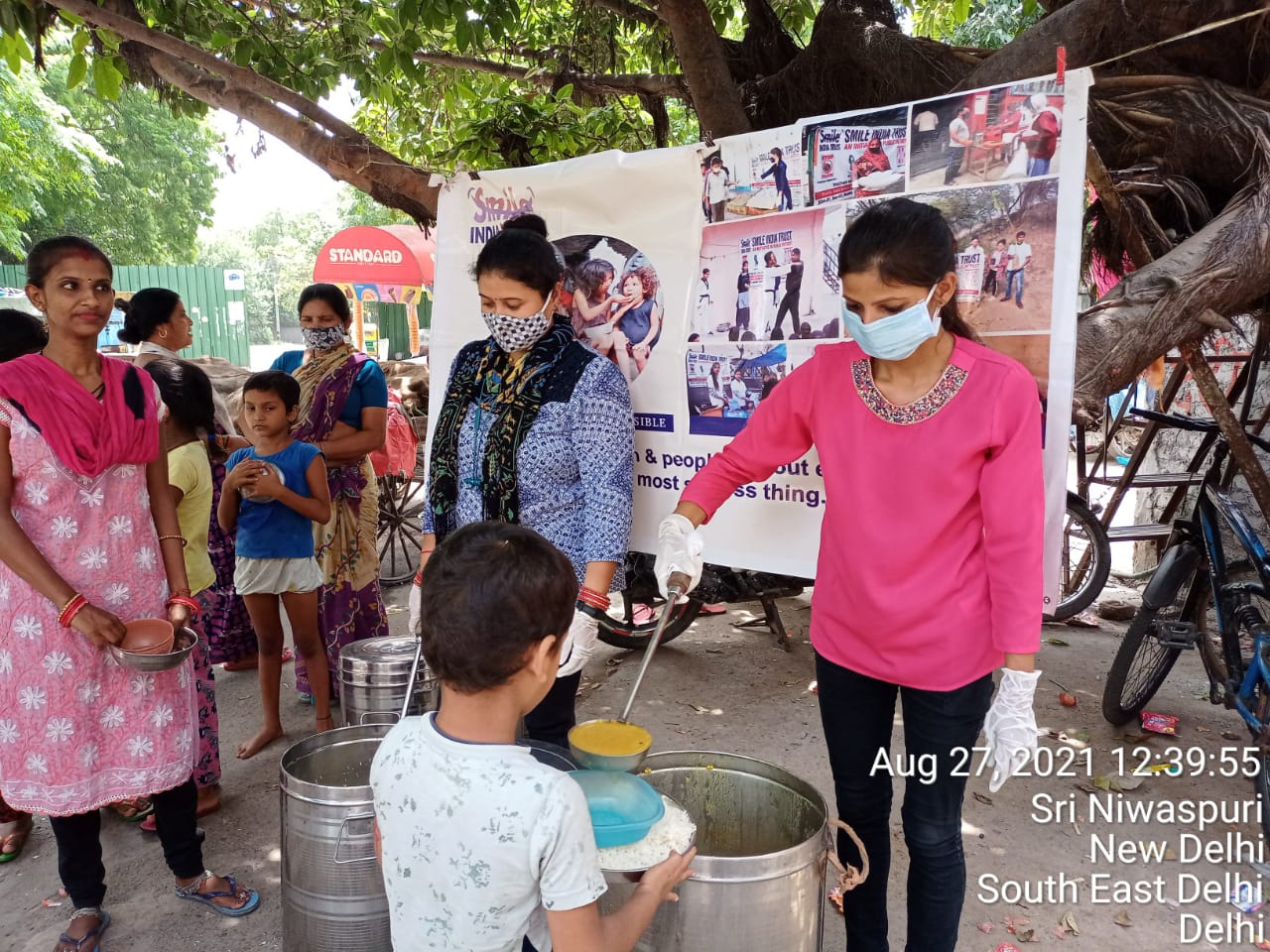Distribution of cooked food to the underprivileged children’s & people